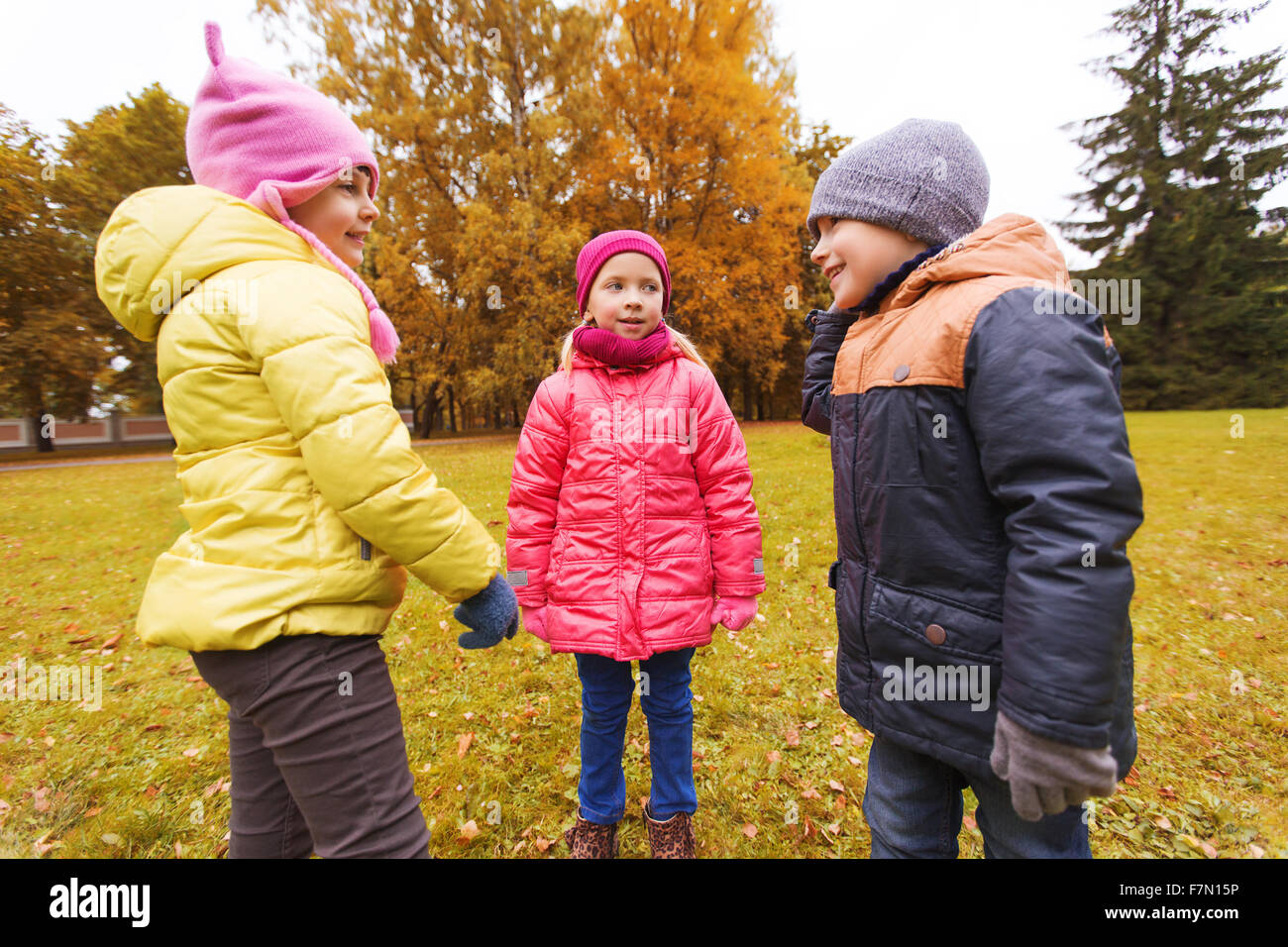 group of happy children talking in autumn park Stock Photo - Alamy