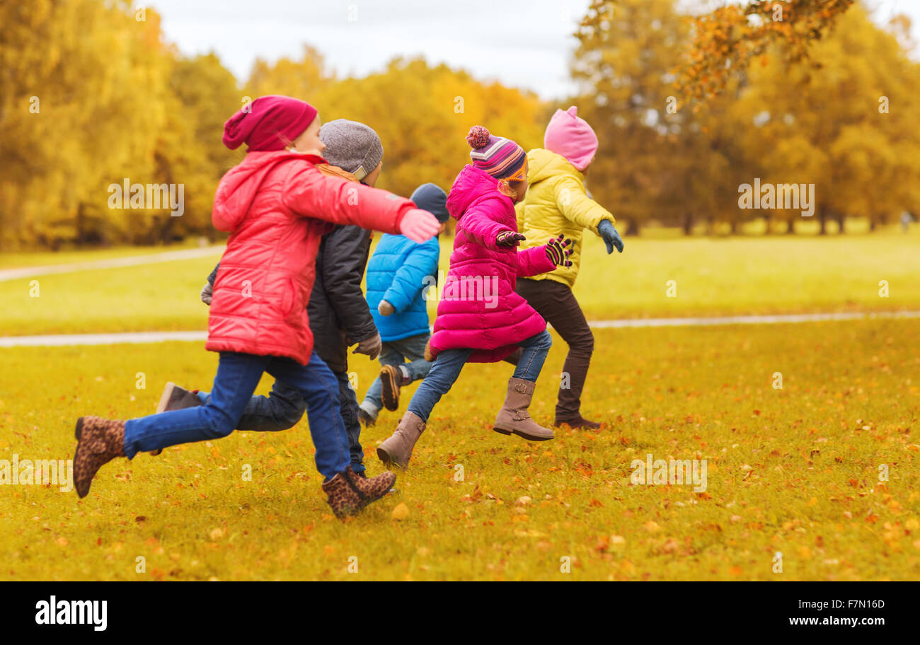 group of happy little kids running outdoors Stock Photo - Alamy