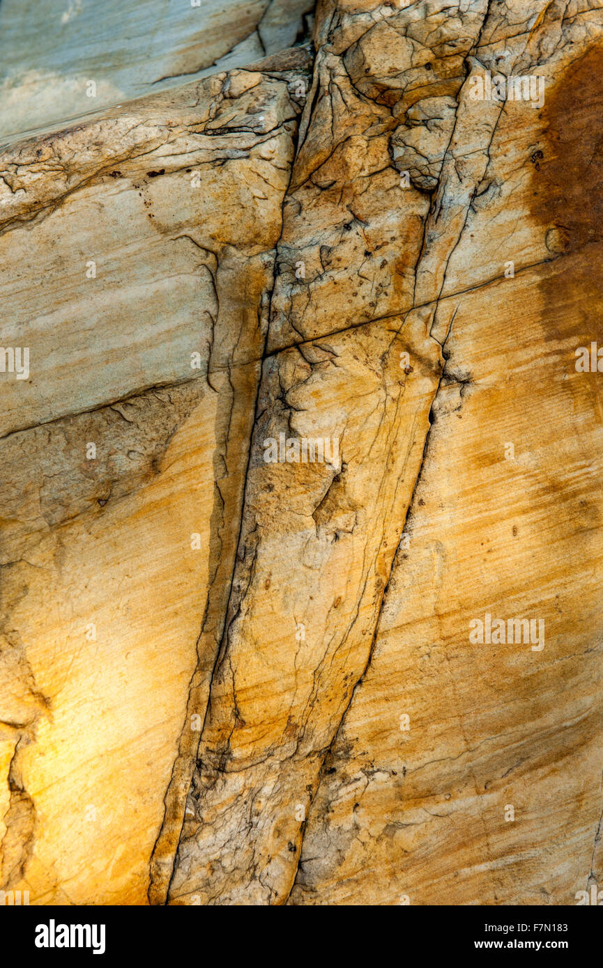 Close up of a golden sandy stone with natural cracks Stock Photo - Alamy