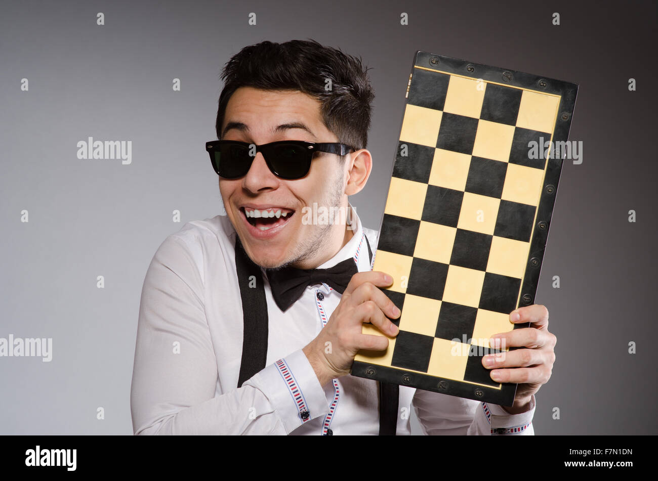 Funny chess player with board Stock Photo - Alamy