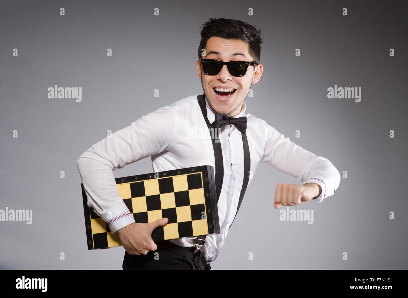 Funny chess player with board Stock Photo - Alamy