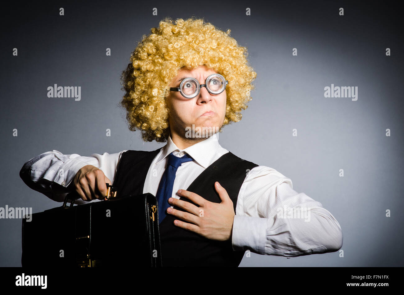 Funny businessman with curly hair Stock Photo - Alamy