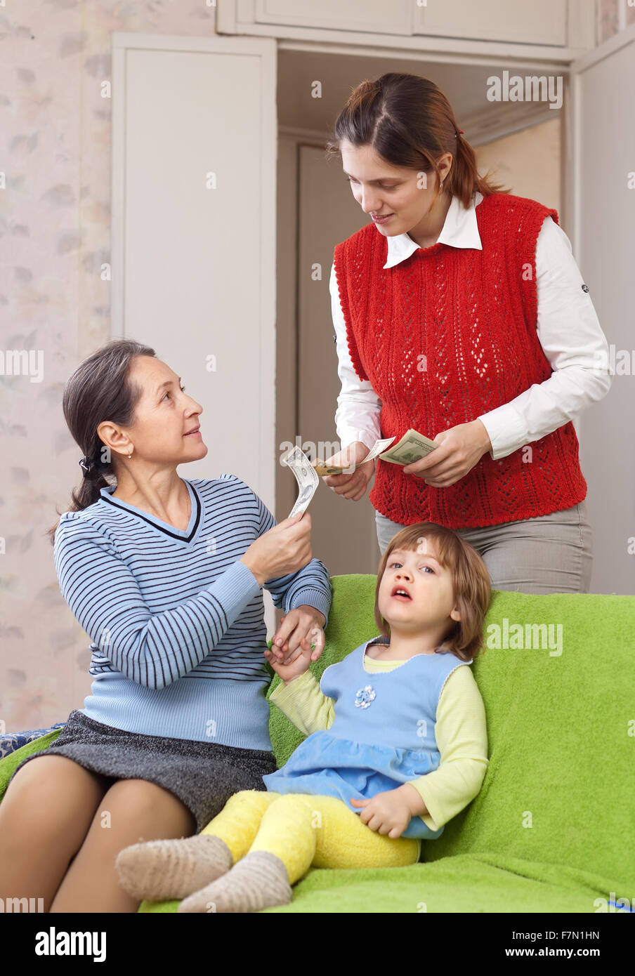 Mother hires nanny for her child Stock Photo - Alamy