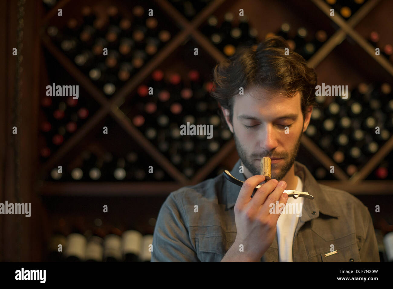 Sommelier sniffing wine cork Stock Photo - Alamy