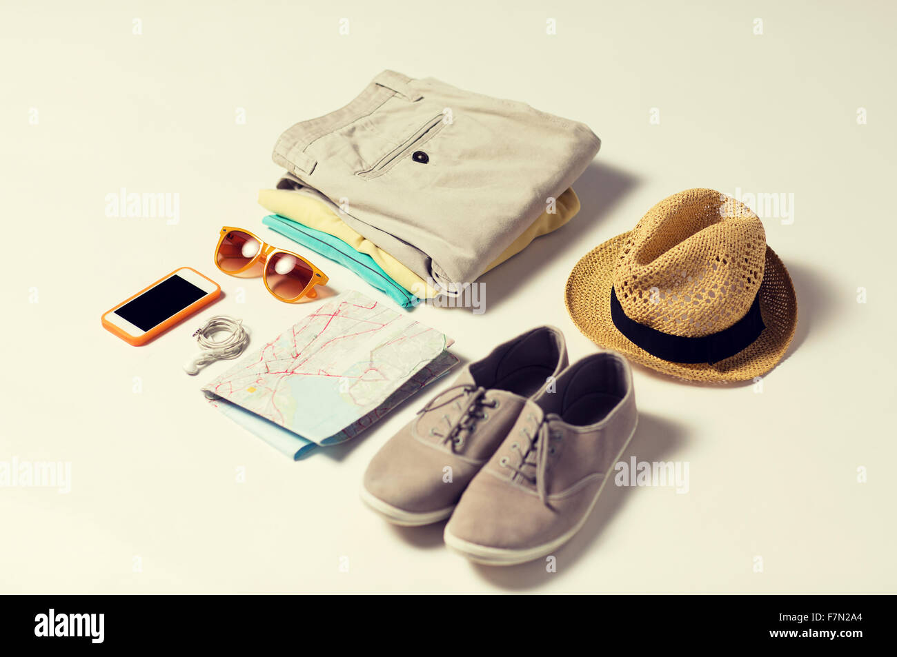 close up of summer clothes and travel map on table Stock Photo - Alamy