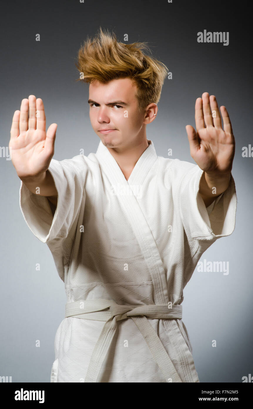 Funny karate fighter wearing white kimono Stock Photo - Alamy