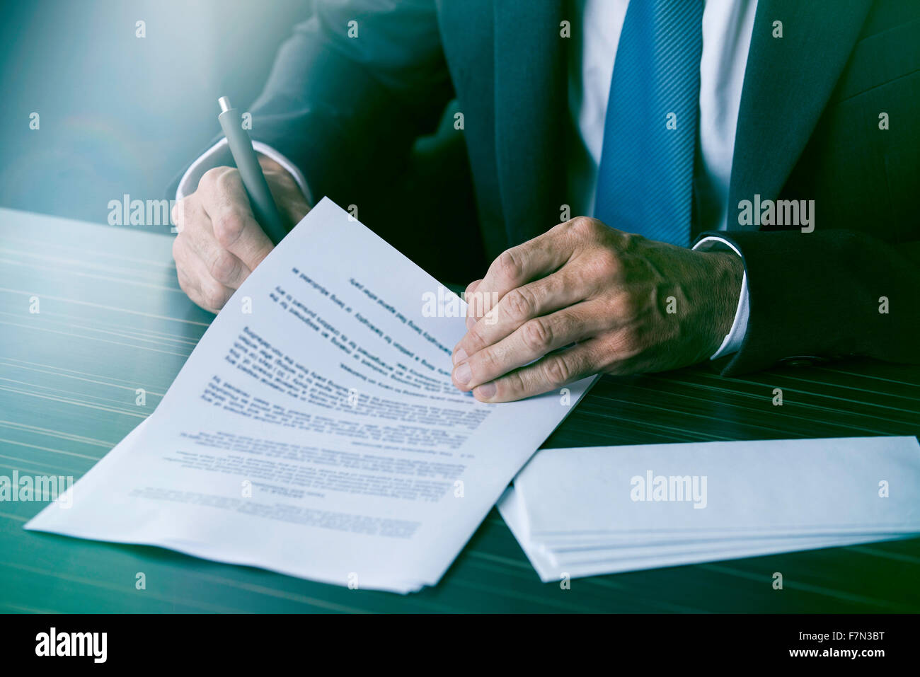 Executive signing document Stock Photo - Alamy