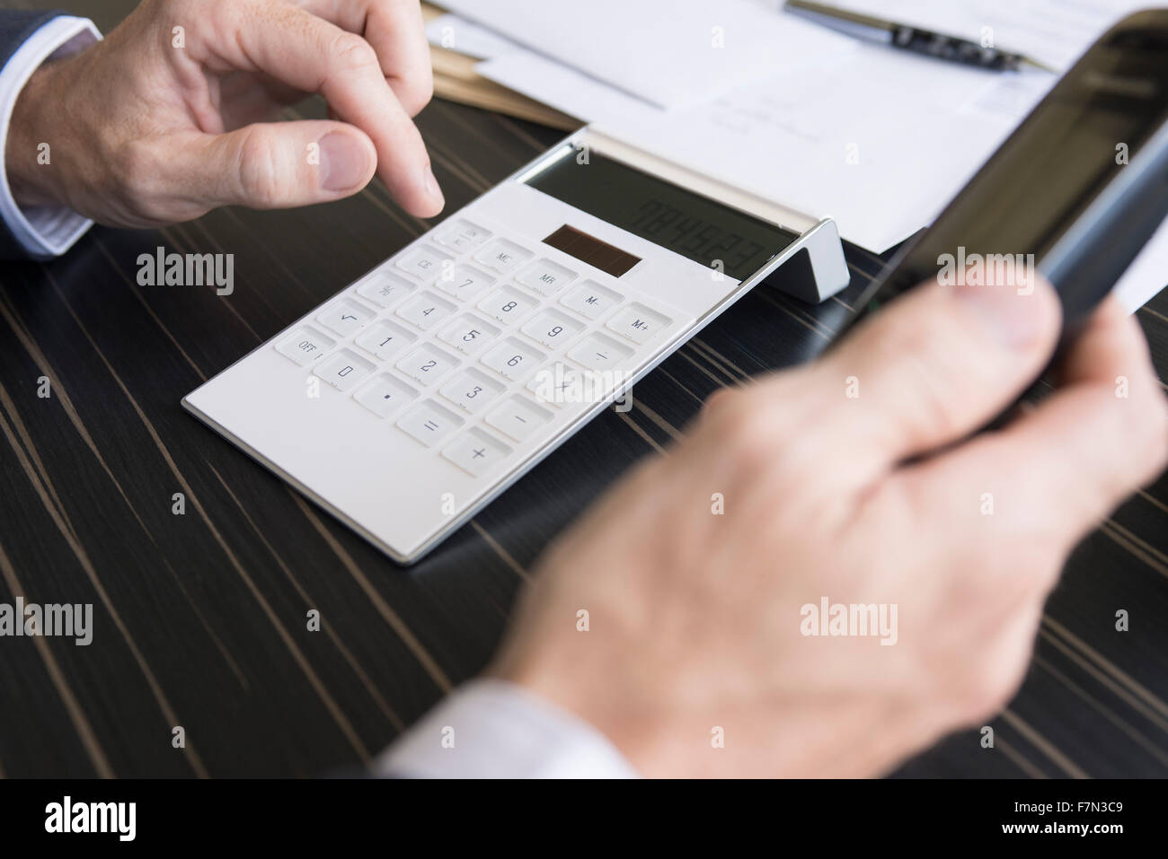 Concerned adults and paperwork hi-res stock photography and images - Alamy