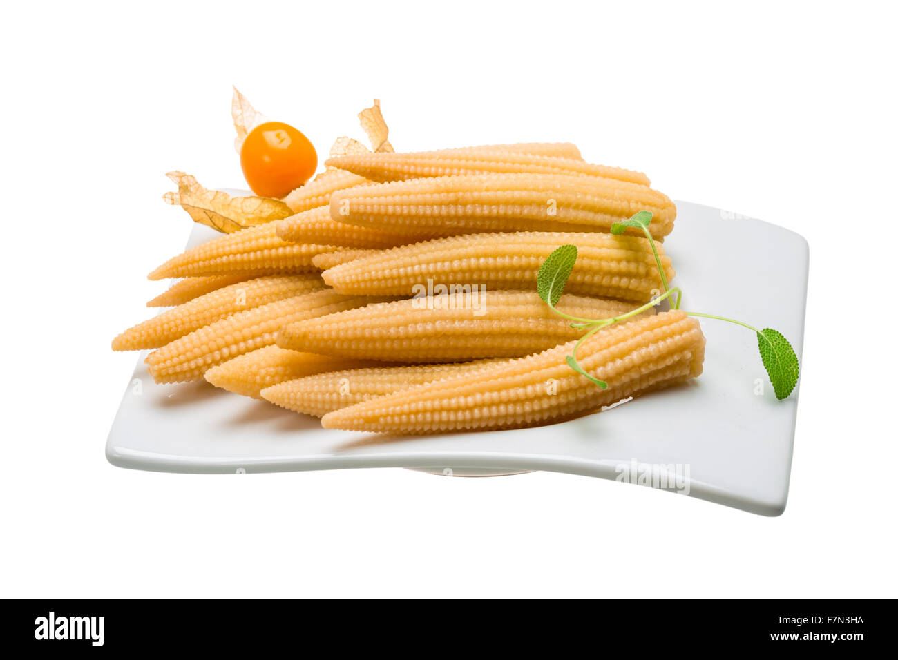 Baby corn with thyme Stock Photo - Alamy