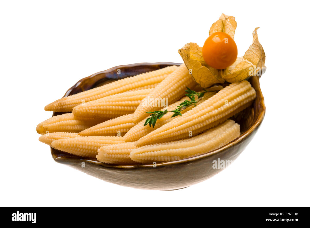 Baby corn with thyme Stock Photo - Alamy