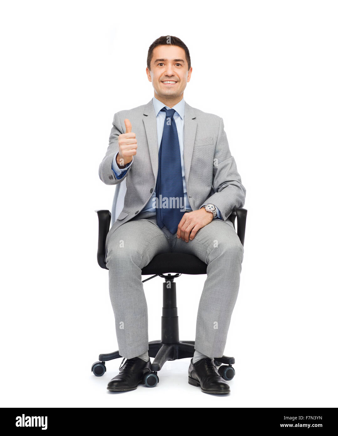 happy businessman sitting in office chair Stock Photo - Alamy