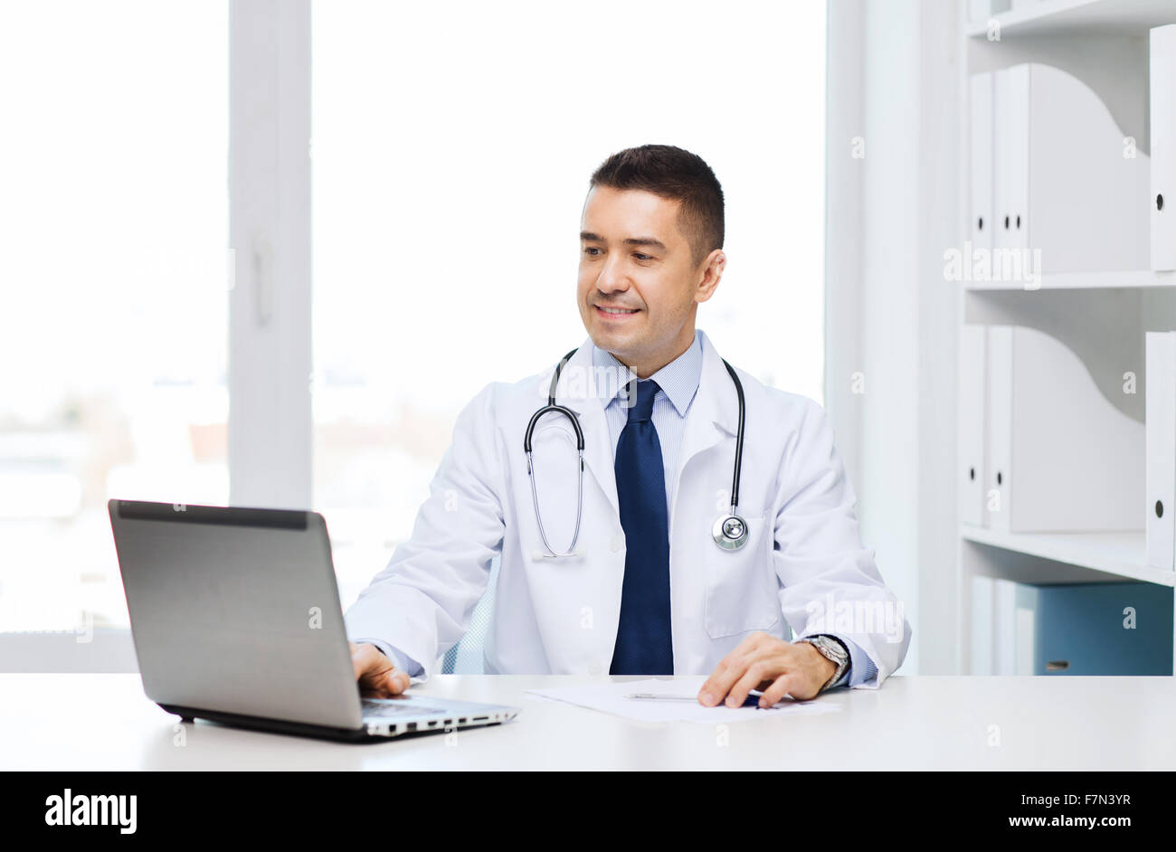 Doctor typing in office hi-res stock photography and images - Alamy