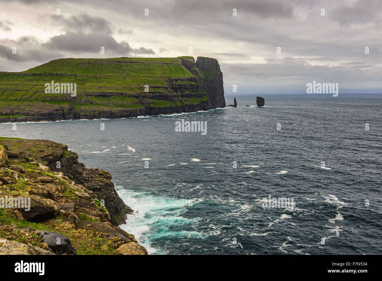 Giant sea cliff and sea stacks shortly after storm on Faroe Islands ...