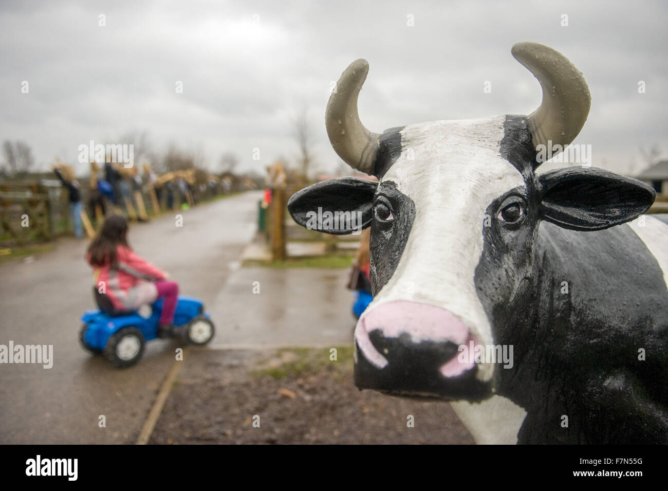 Plastic cow statue at farm fair Stock Photo - Alamy
