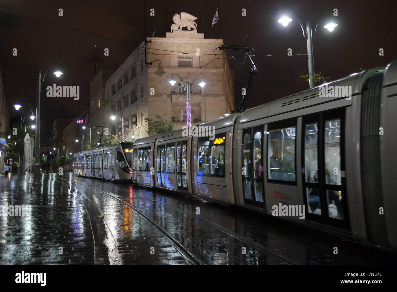 The Jerusalem Light Rail or Jerusalem Tramway pass during a rainy night ...