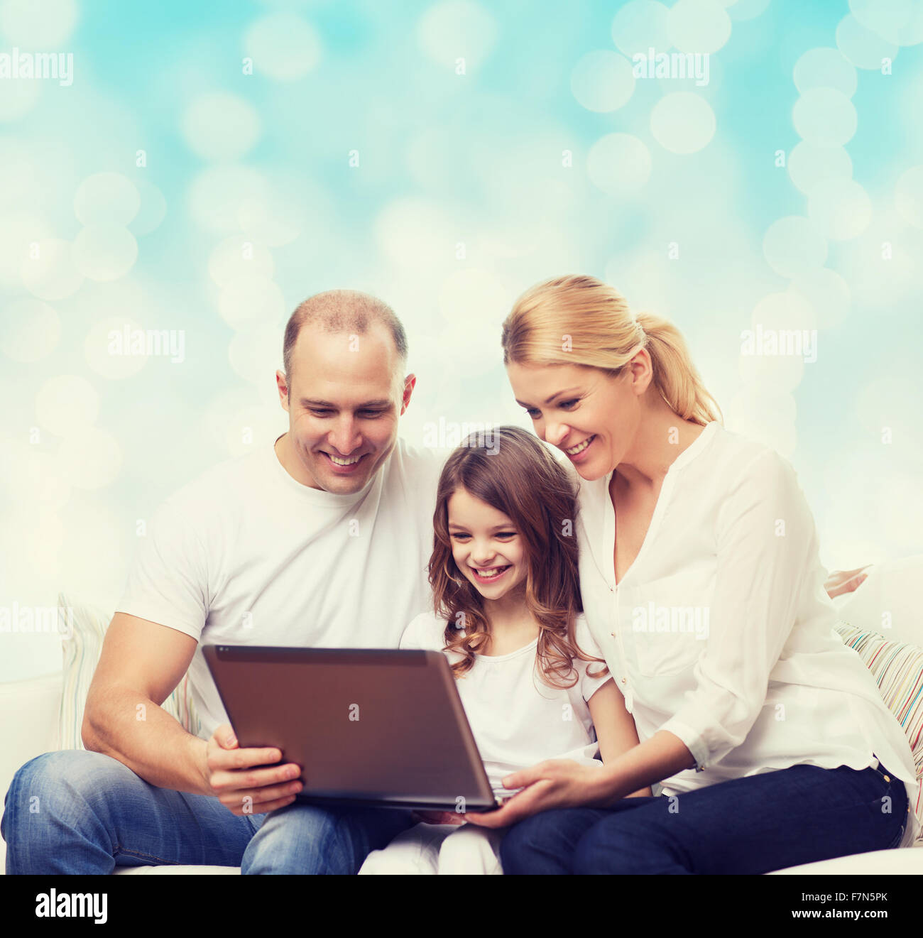 smiling family with laptop Stock Photo - Alamy
