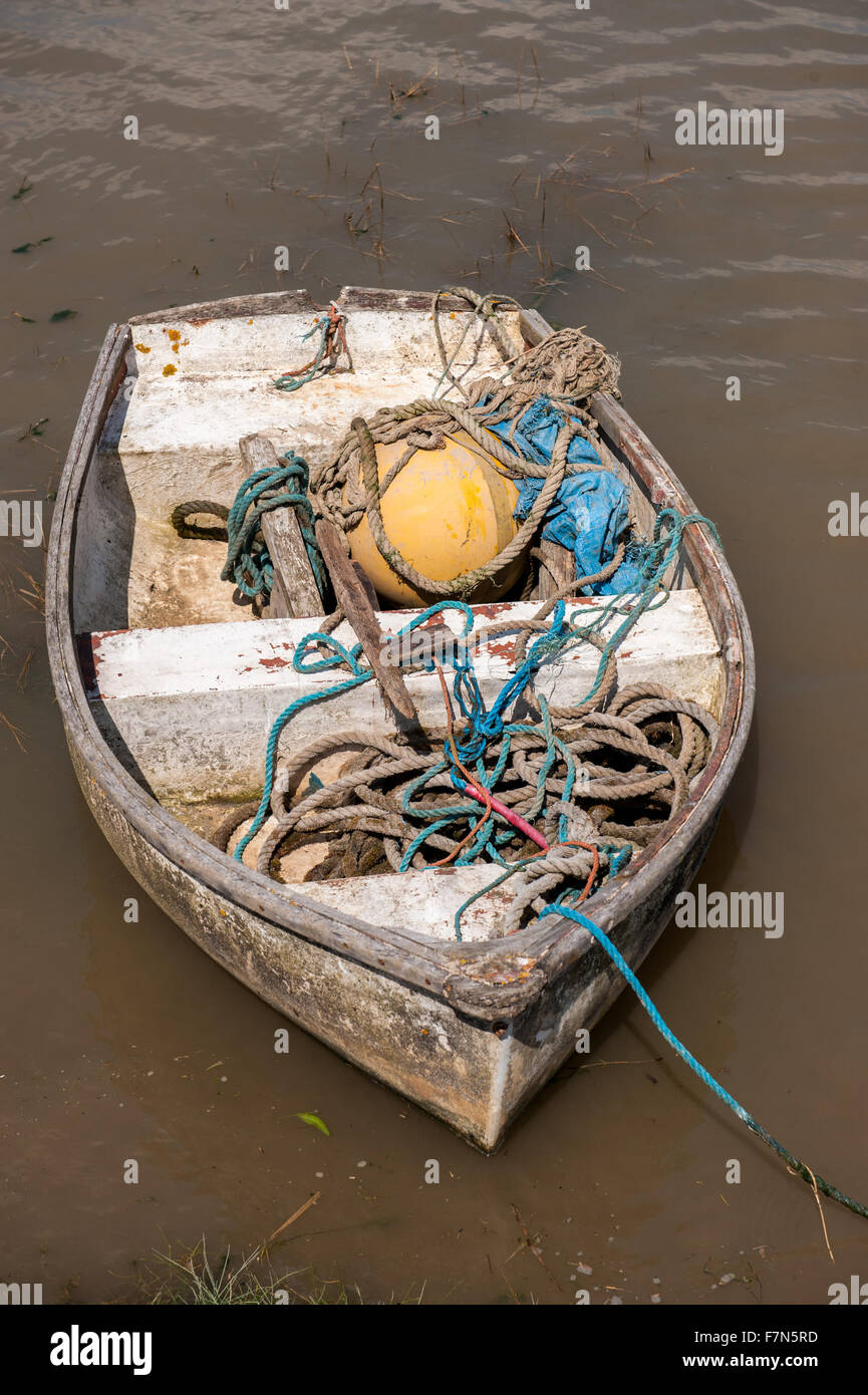 Single floating boat on water with ropes and equipment on board Stock ...