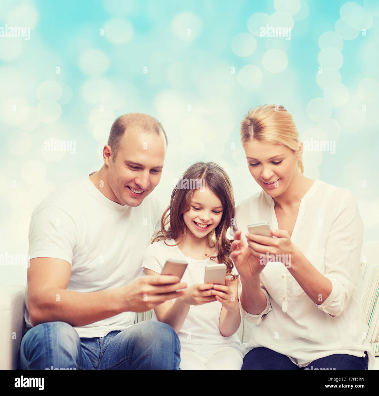 happy family with smartphones Stock Photo - Alamy
