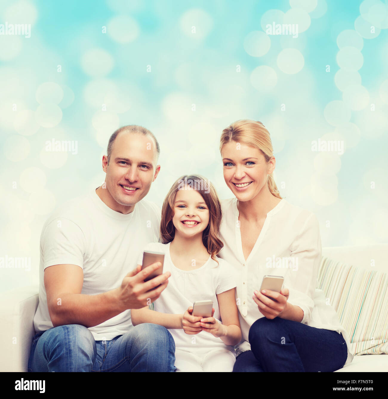 happy family with smartphones Stock Photo - Alamy
