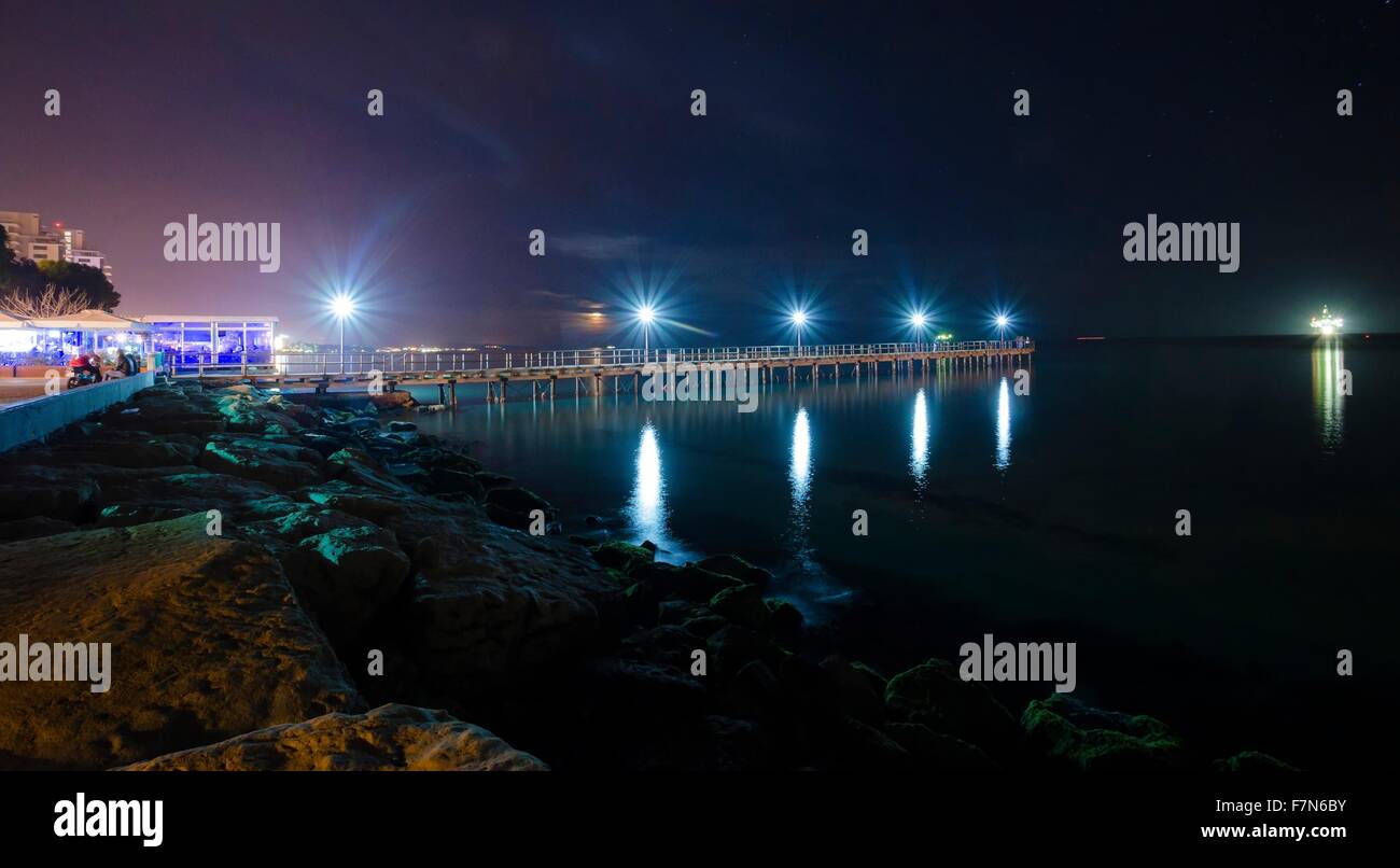 The Limassol pier in Enaerios Area in Cyprus. A night view of the city ...