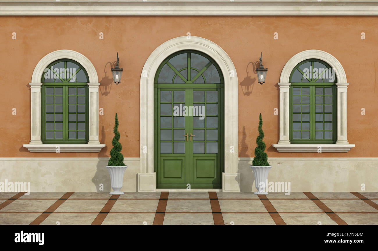 Detail of a classic facade with two arched windows with stone frame and ...