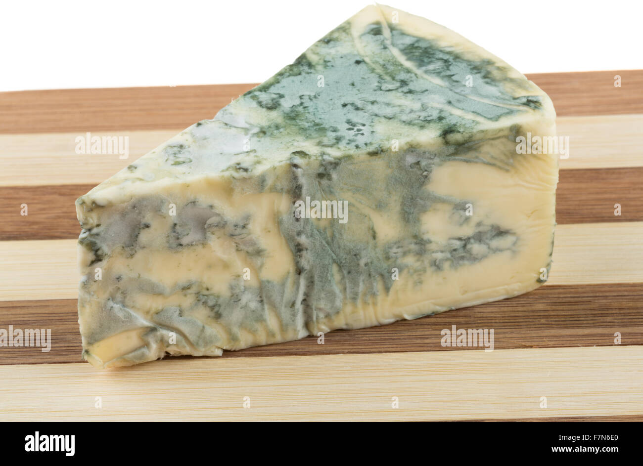 Wedge of soft blue cheese, isolated on white Stock Photo - Alamy