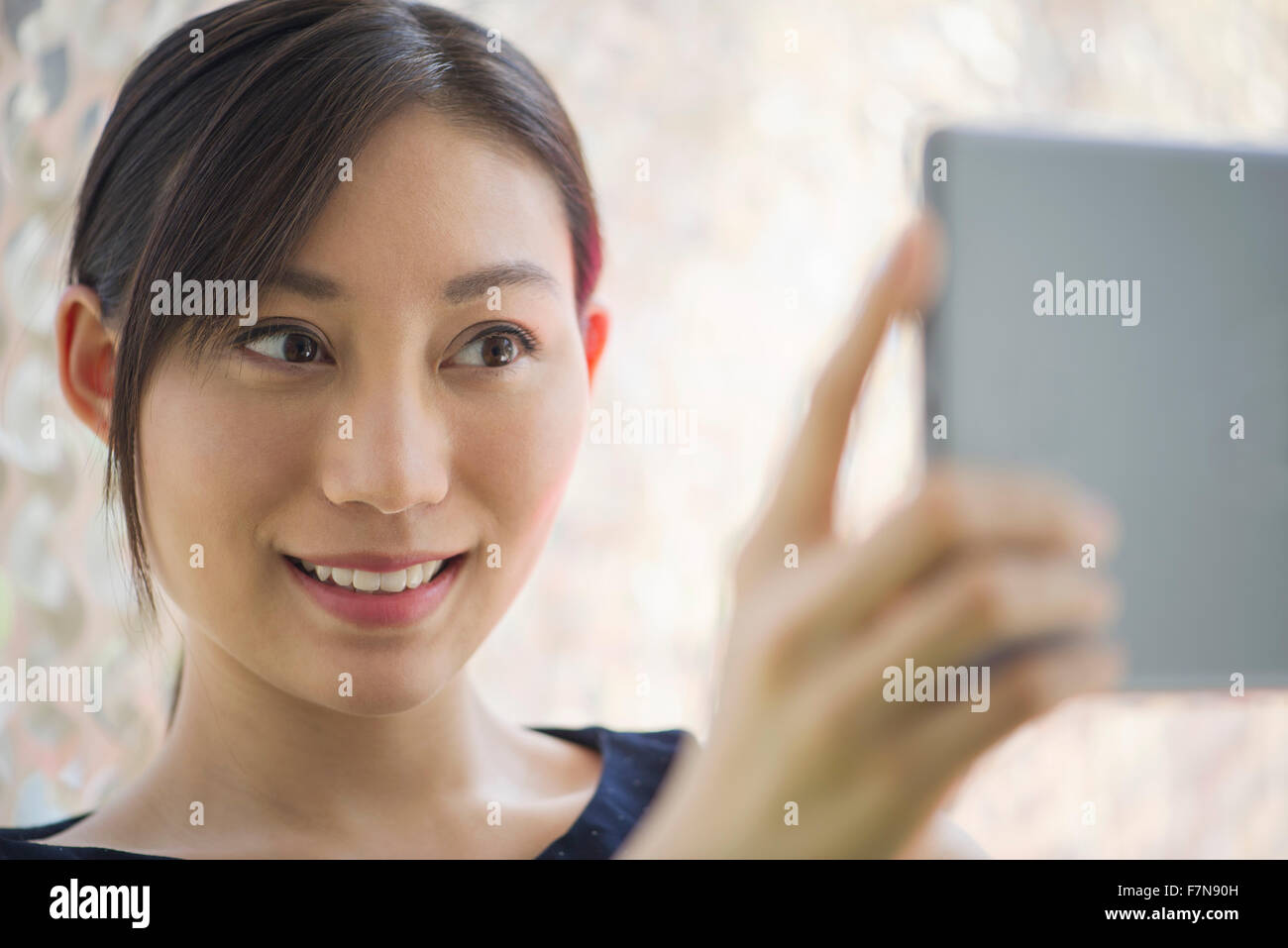 Taking a photograph with tablet device hi-res stock photography and ...