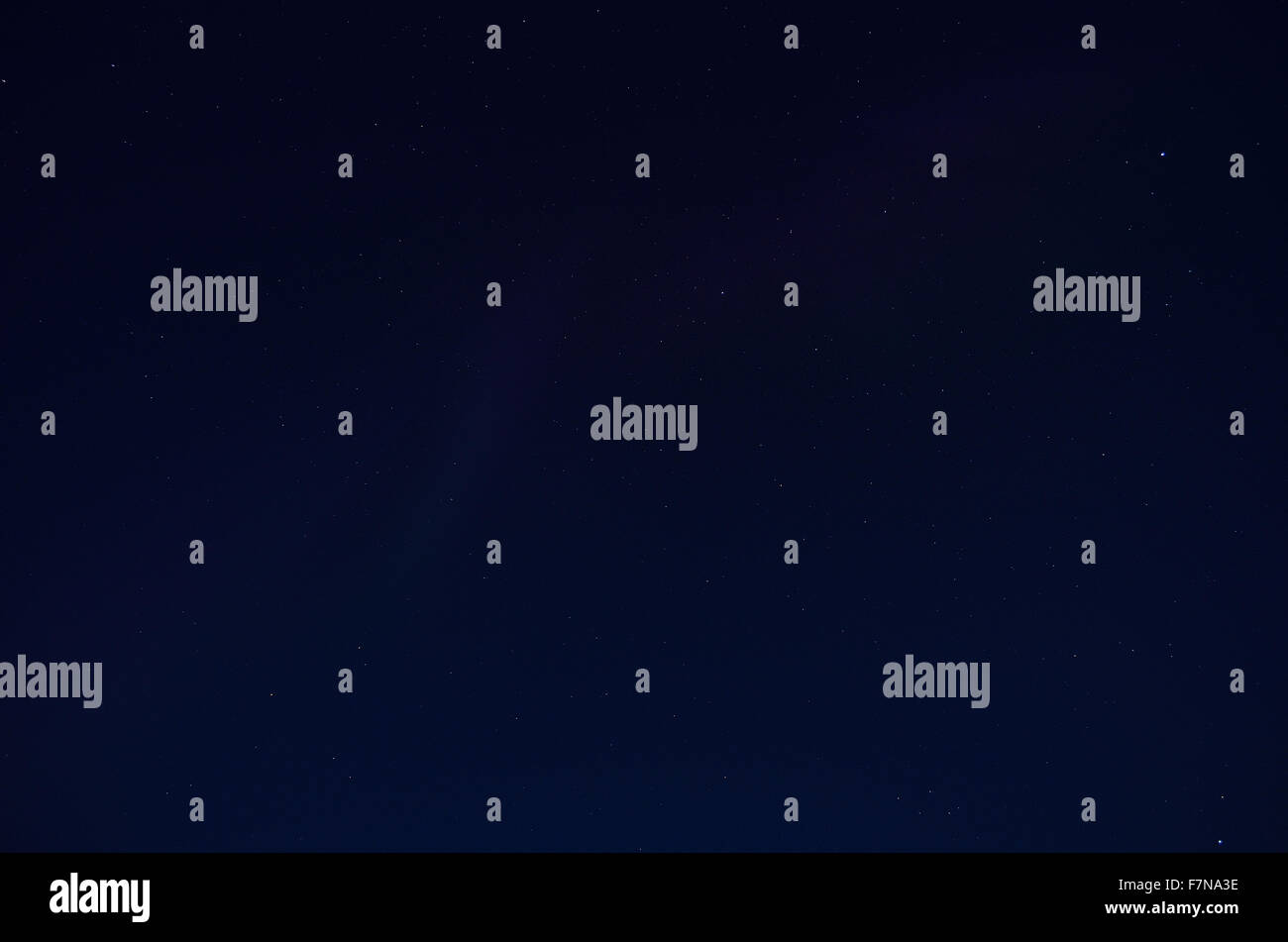 faint aurora borealis on blue star filled autumn night sky Stock Photo ...