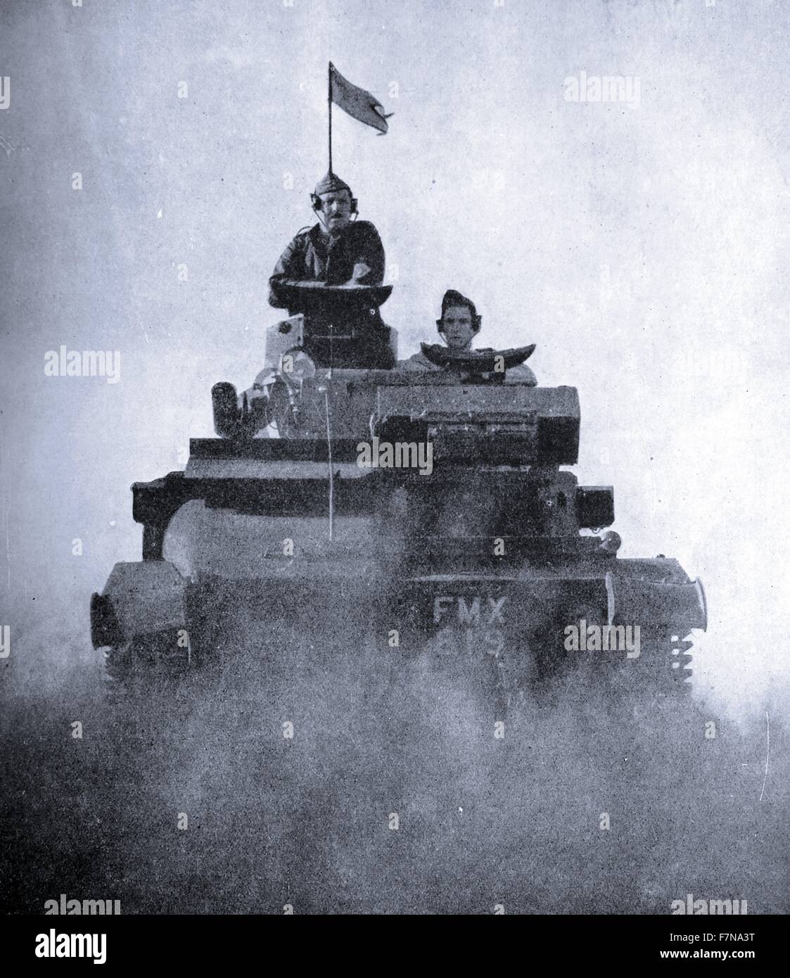 Photograph of a tank being used during World War Two. The flags borne ...