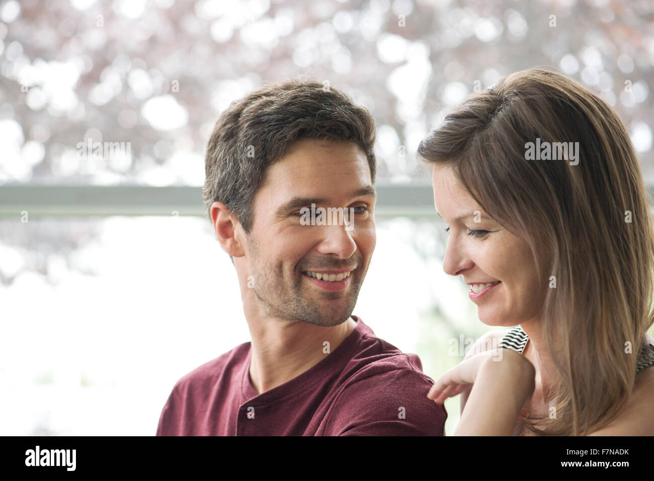 Couple smiling together Stock Photo - Alamy