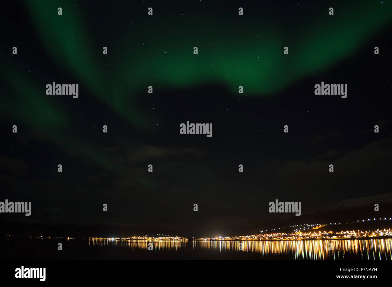 strong vibrant aurora borealis, northern light in autumn night in the ...