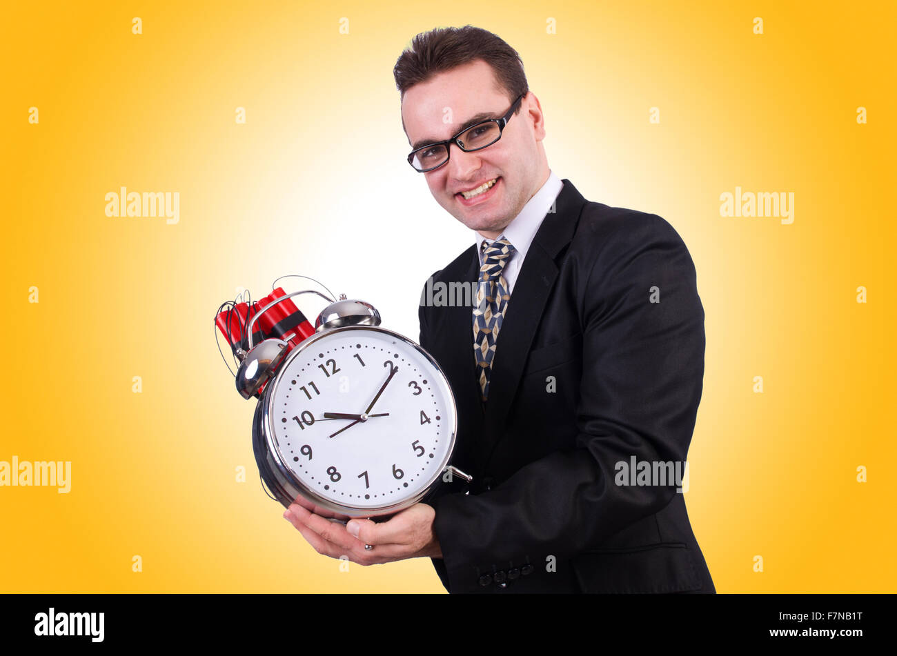 Man with time bomb isolated on white Stock Photo - Alamy