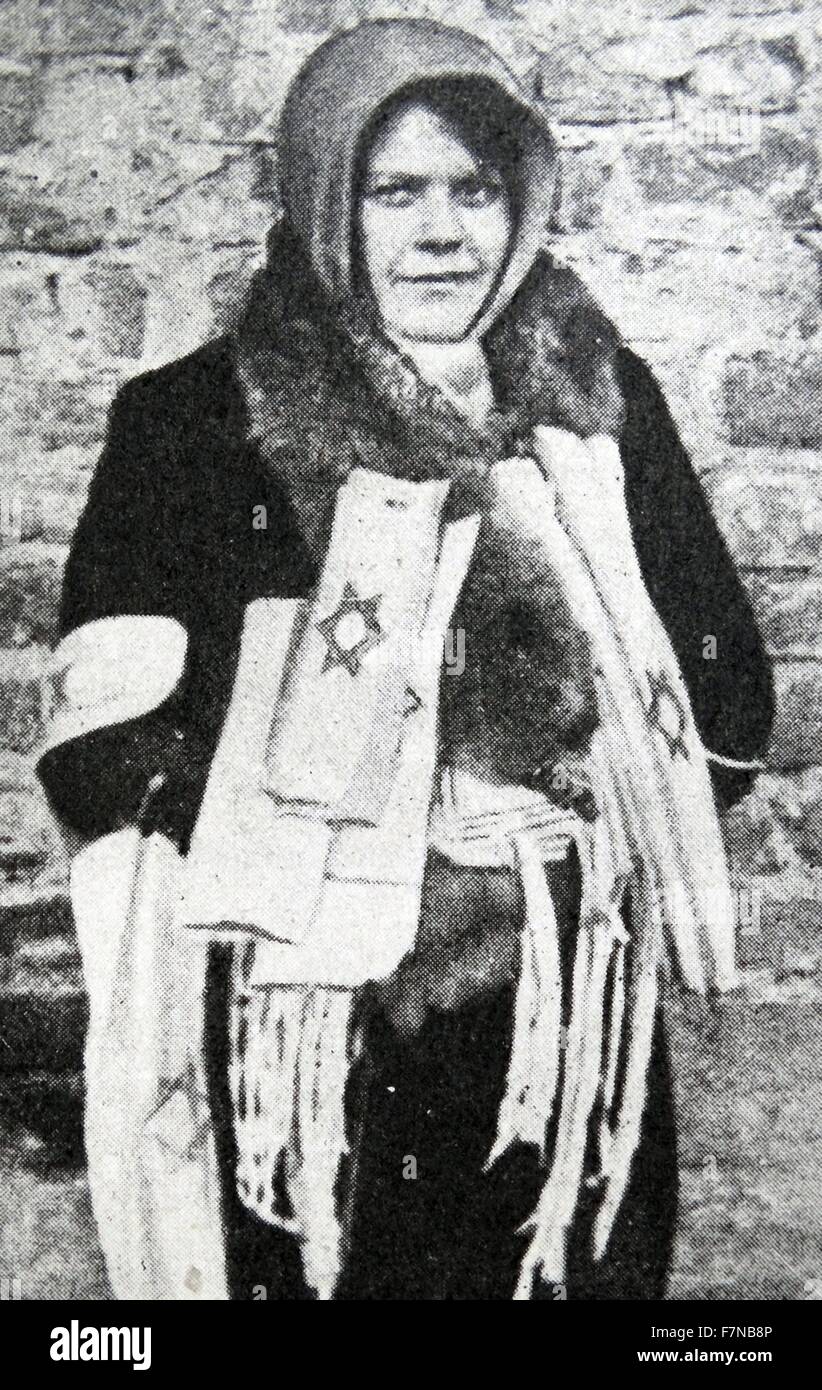 Photograph of a Jewish woman wearing the badge of Jewry. Also known as ...