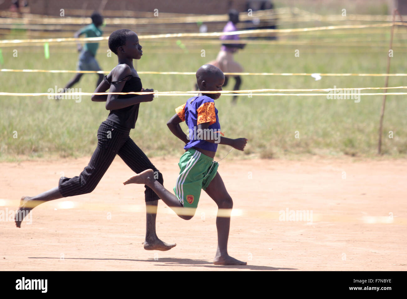 Children taking part in a community charity run in Otuke district in ...