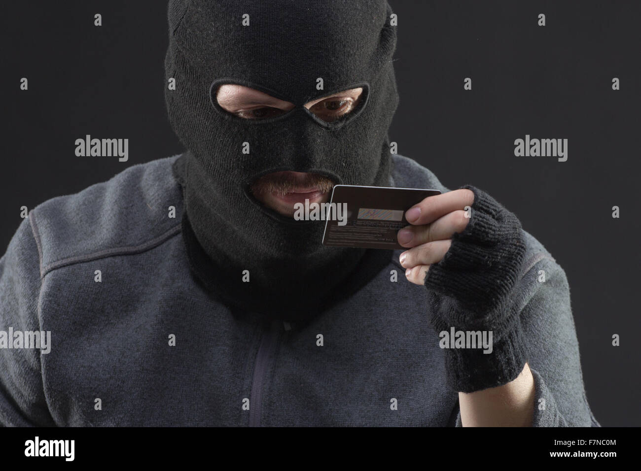 Hacker in balaclava hacking hi-res stock photography and images - Alamy