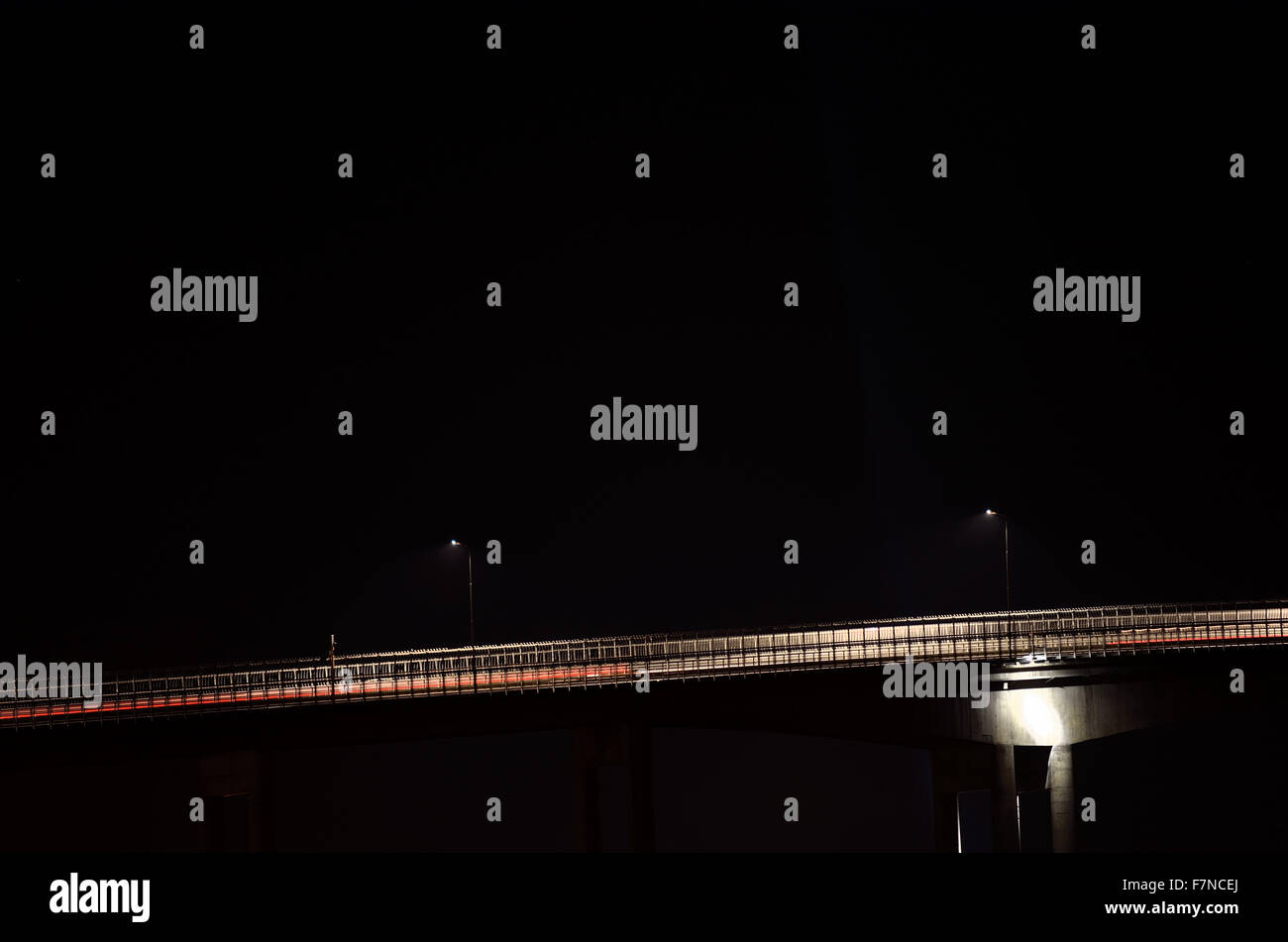 motion and traffic over bridge at night Stock Photo - Alamy