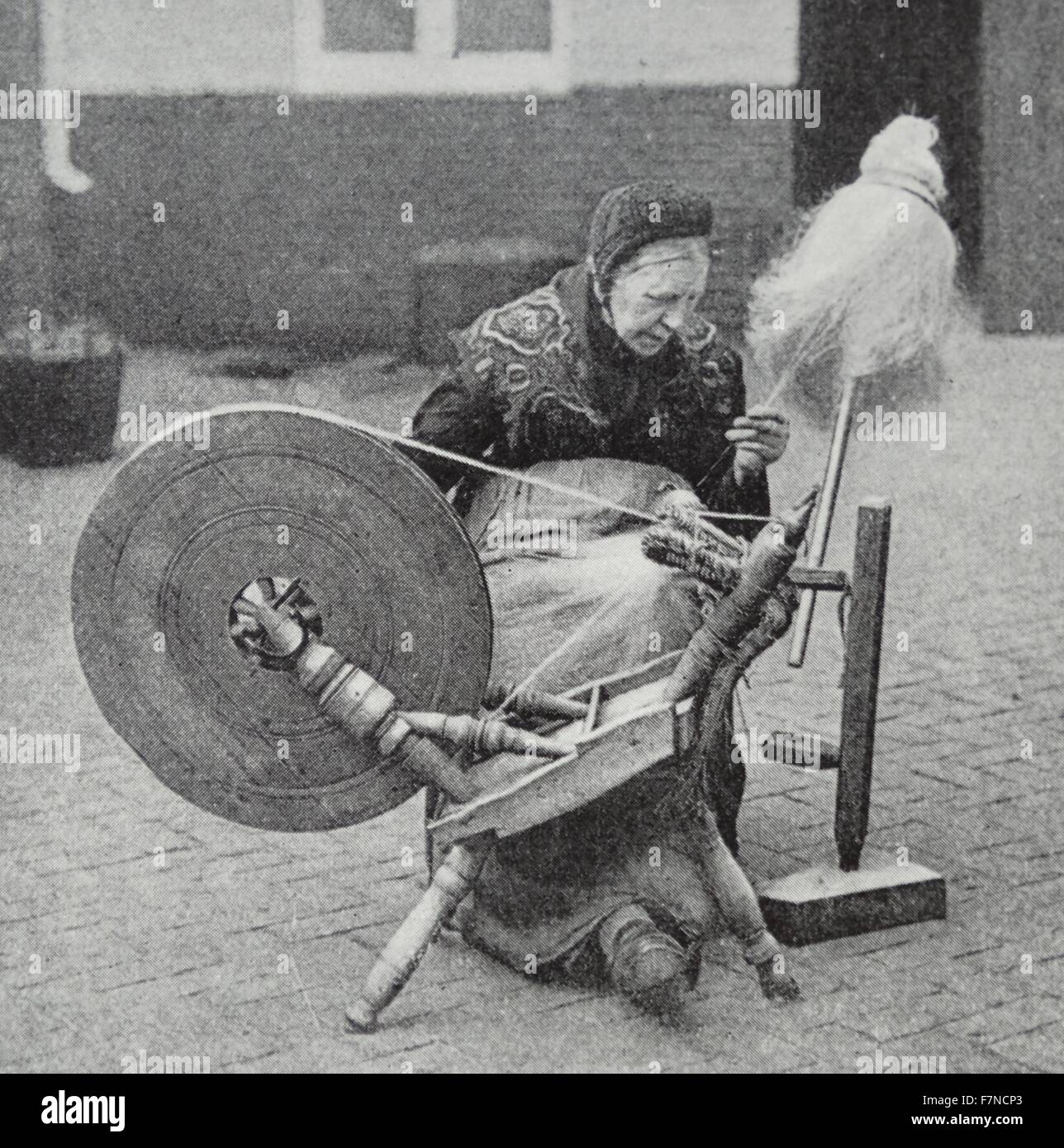 An old belgian lacemaker with her spinning wheel Stock Photo - Alamy