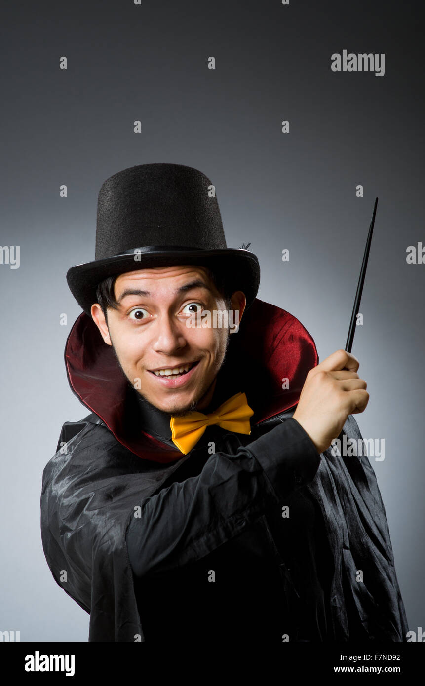Funny magician man with wand and hat Stock Photo - Alamy