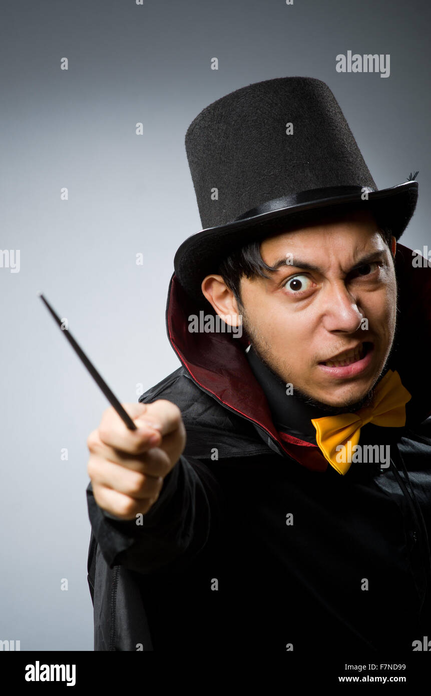 Funny magician man with wand and hat Stock Photo - Alamy