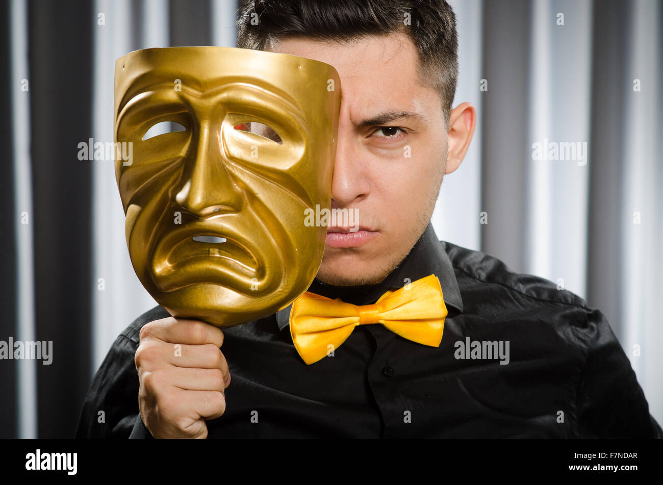 Funny concept with theatrical mask Stock Photo - Alamy