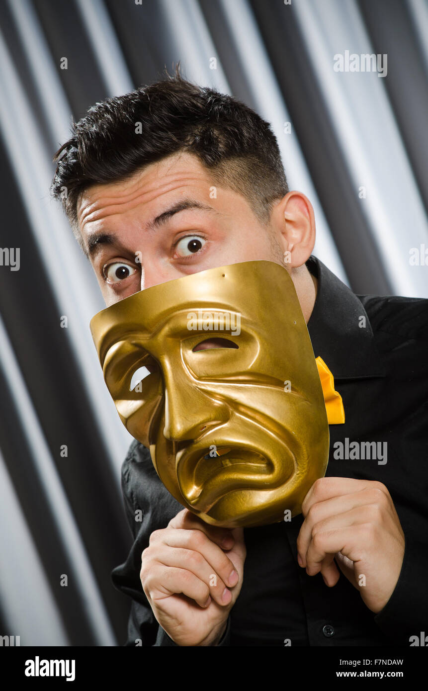 Funny concept with theatrical mask Stock Photo - Alamy