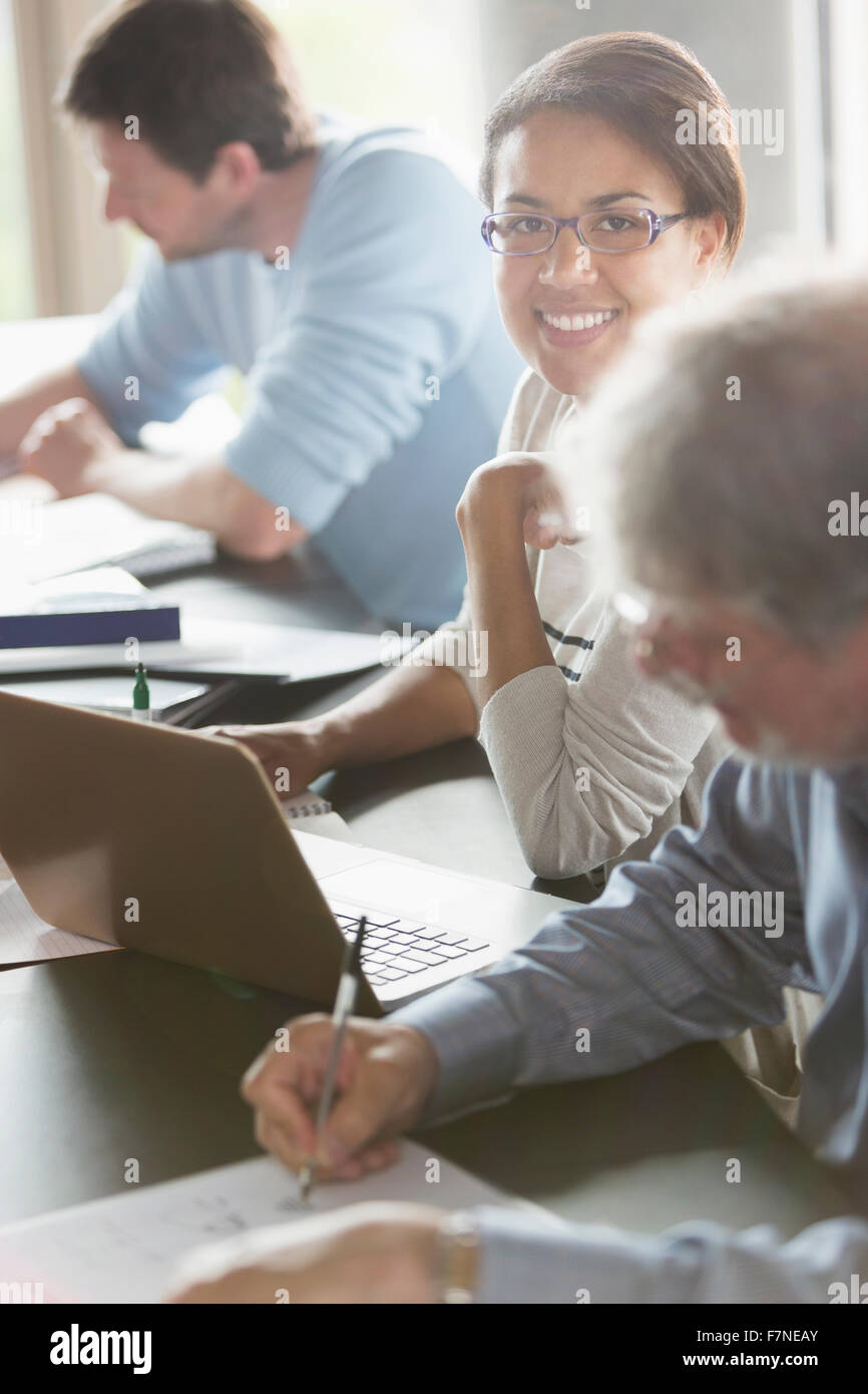 Portrait smiling woman studying in adult education classroom Stock ...