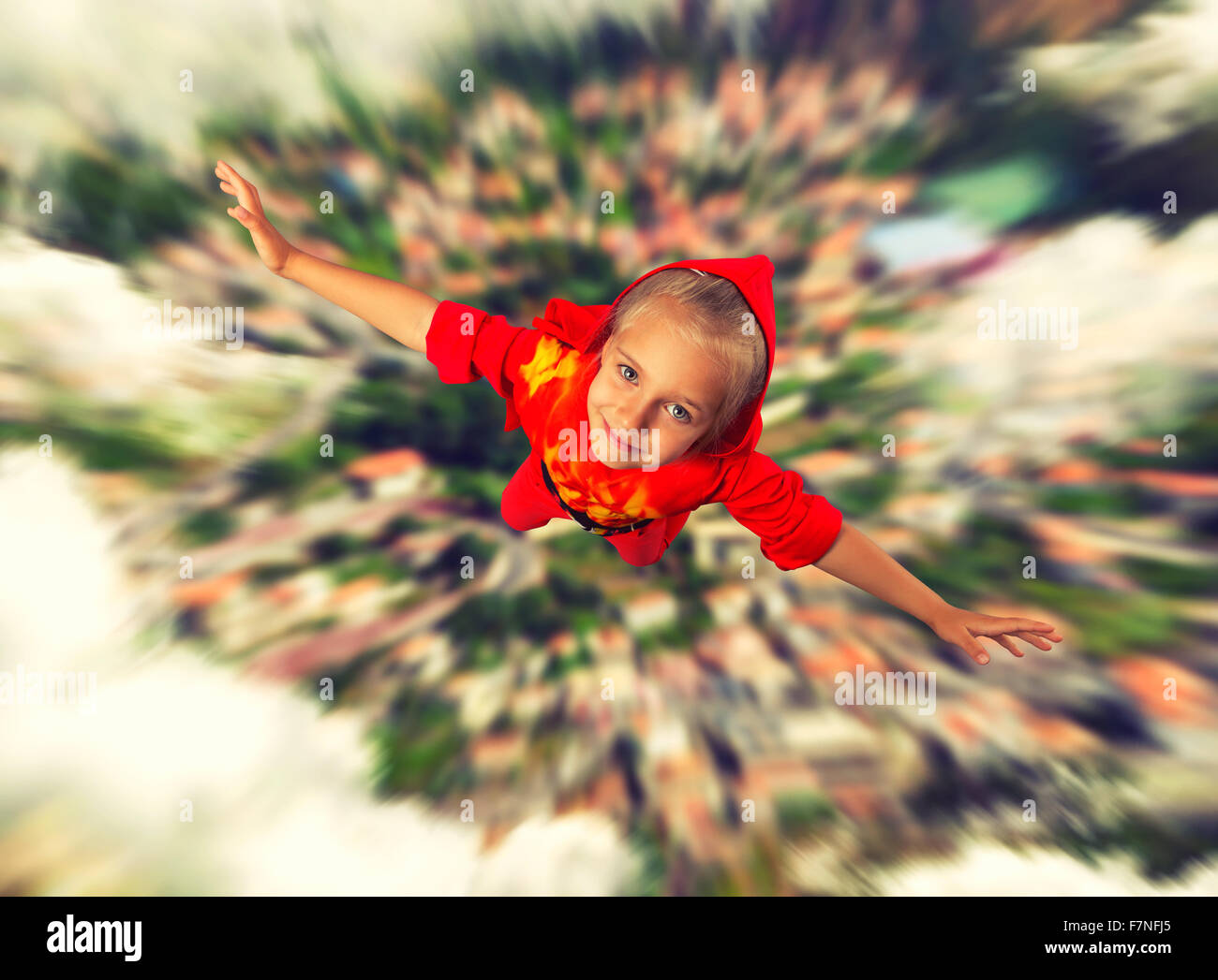 Super hero girl flying Stock Photo - Alamy