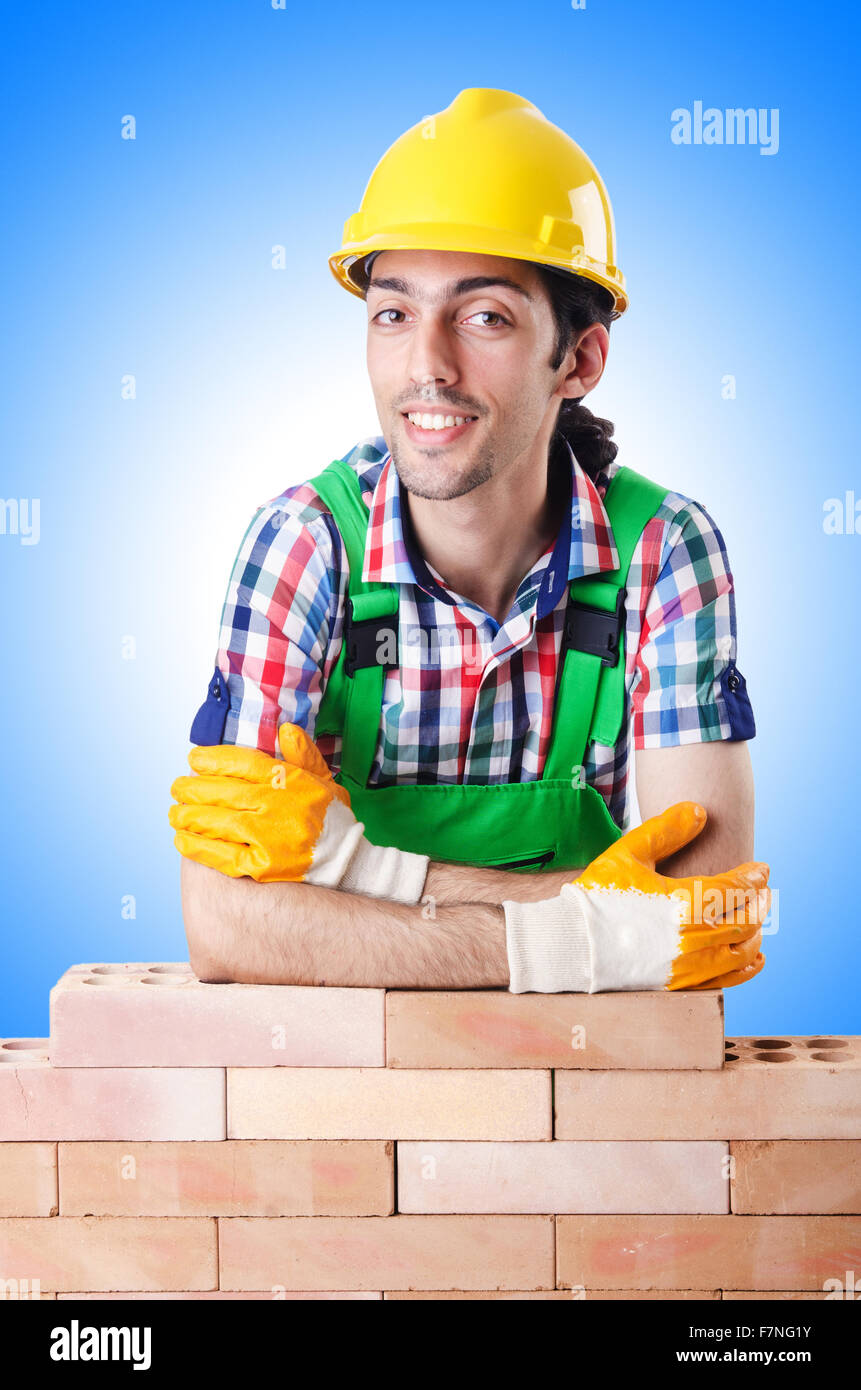 Builder with hard hat on white Stock Photo - Alamy
