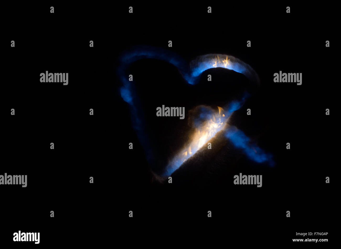 vibrant heart shape burning blue in white snow Stock Photo - Alamy