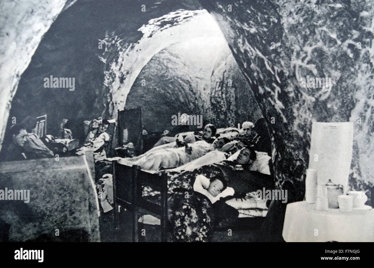 People shelter in underground caverns around London during World War ...