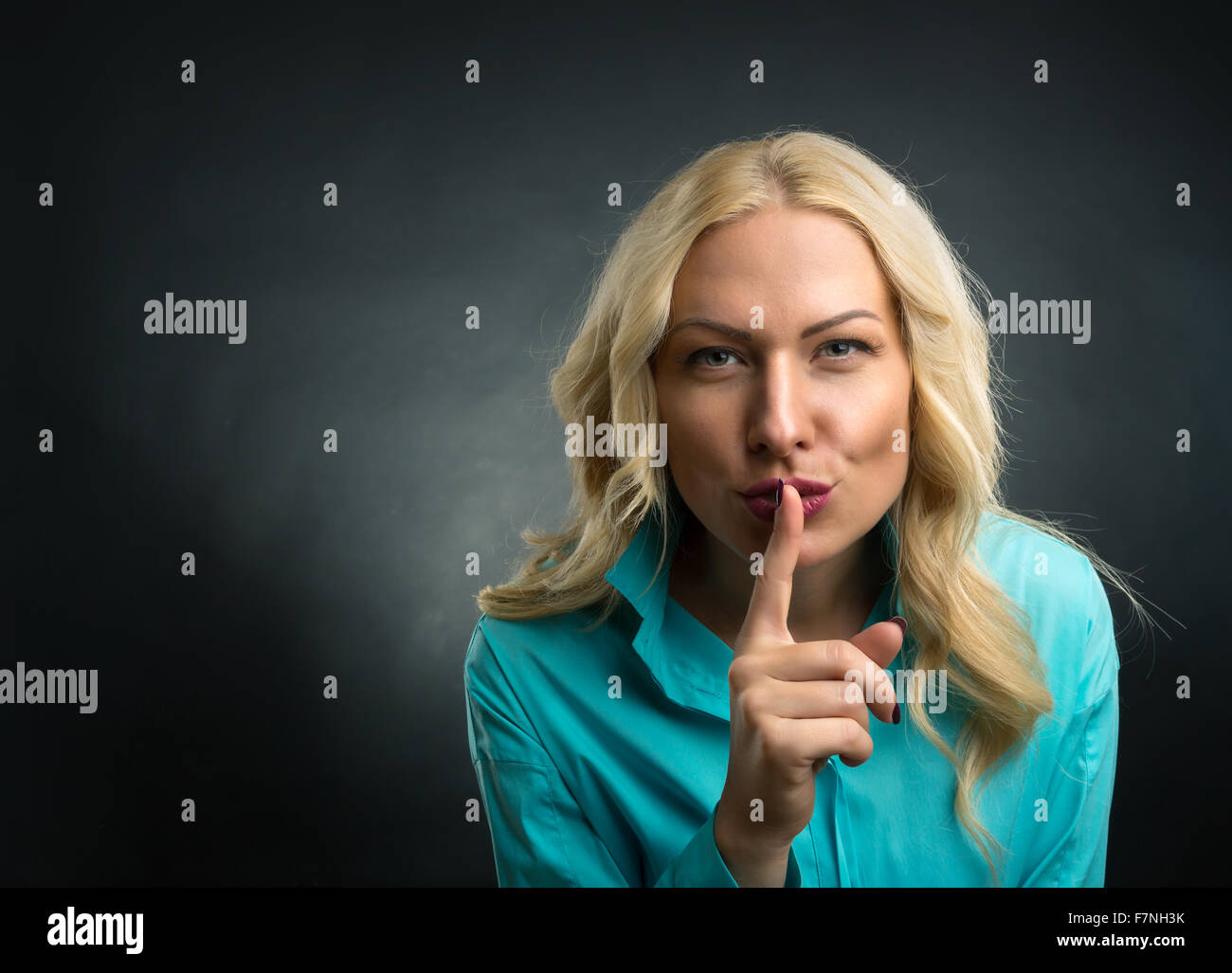 Silence hand sign Stock Photo - Alamy