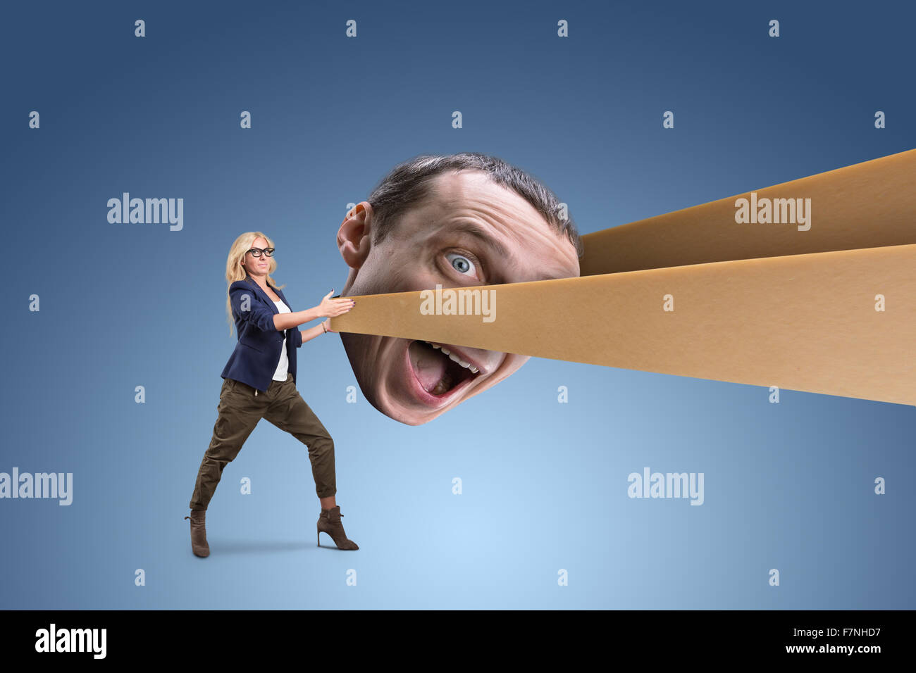 Woman pulling man's head Stock Photo - Alamy
