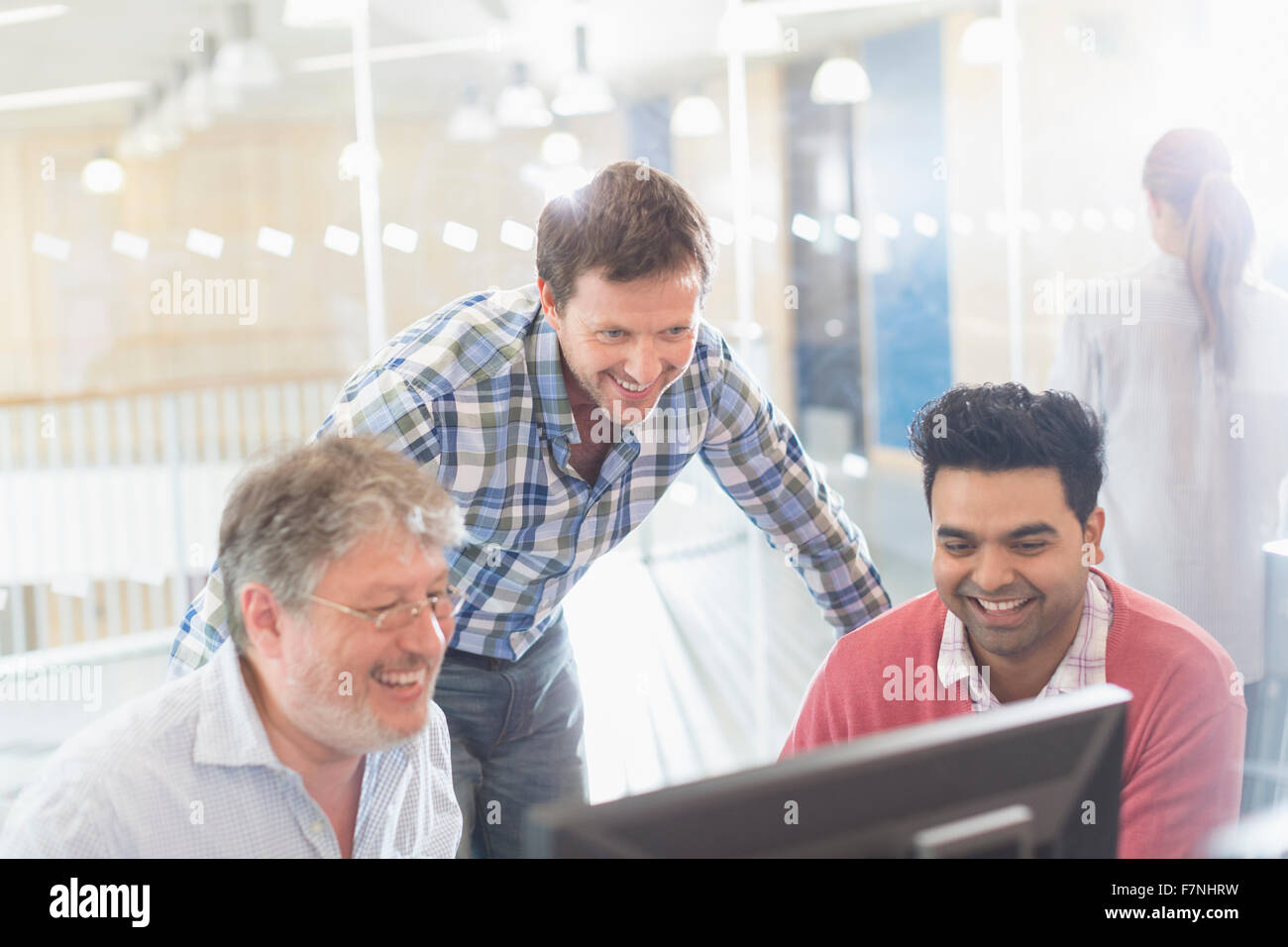 Smiling while working hi-res stock photography and images - Alamy