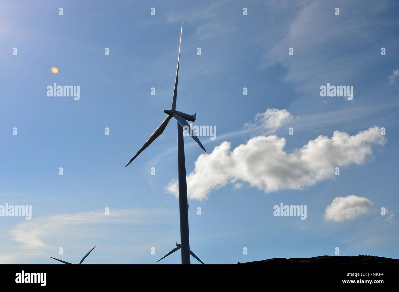 windmill on blue sky background with some clouds Stock Photo - Alamy